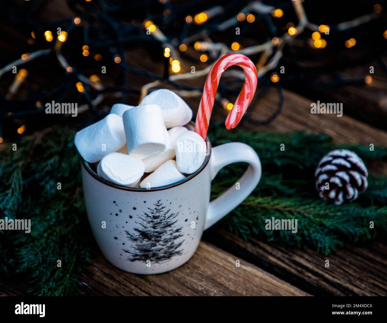 hot Christmas drink with marshmallow on wooden table Stock Photo - Alamy