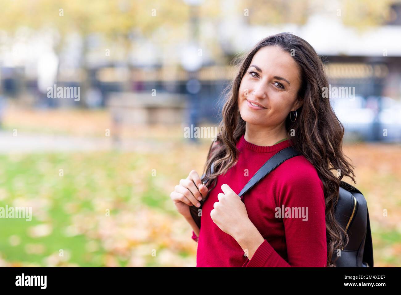 Beautiful woman backpack standing outdoors hi-res stock photography and ...