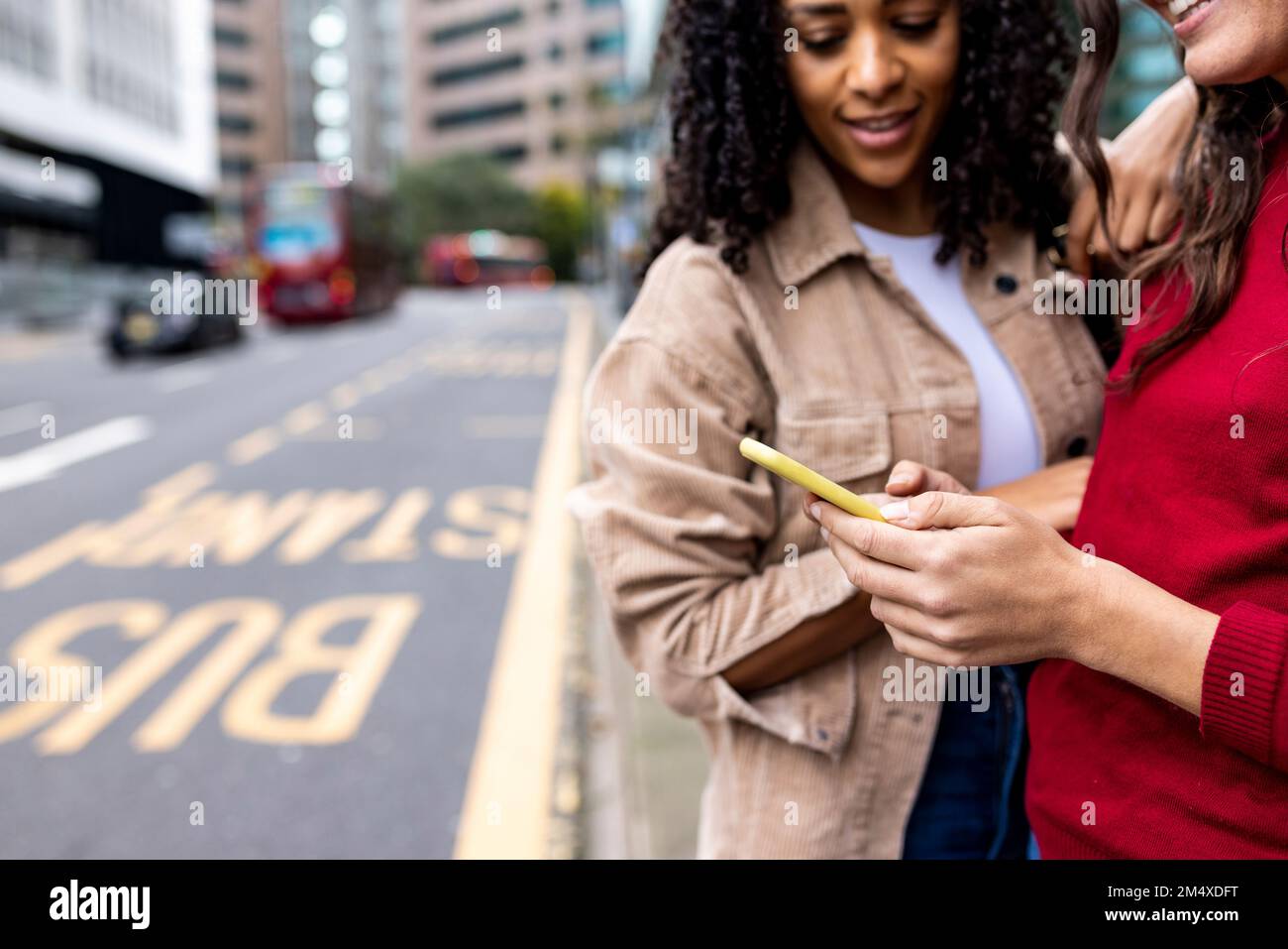 Mobile phone bus stop woman hi-res stock photography and images - Alamy