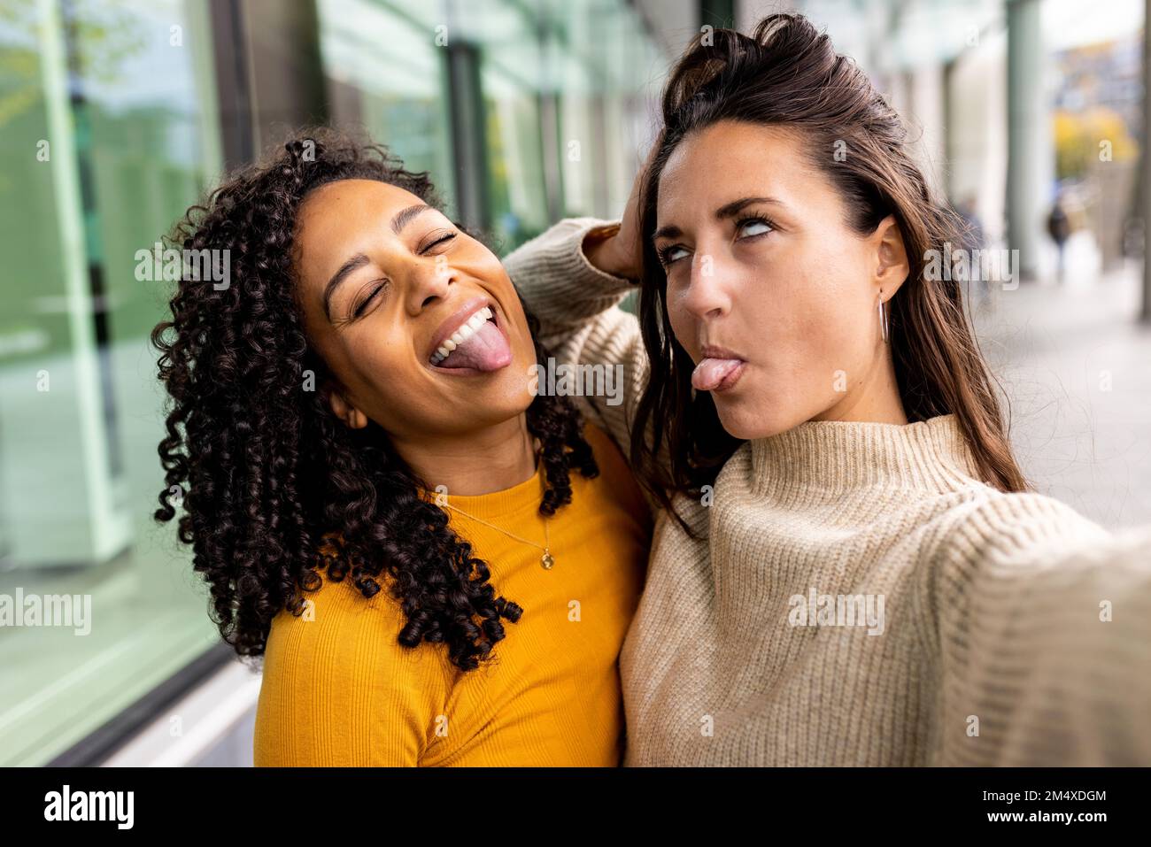 Women talking selfie and making faces Stock Photo - Alamy
