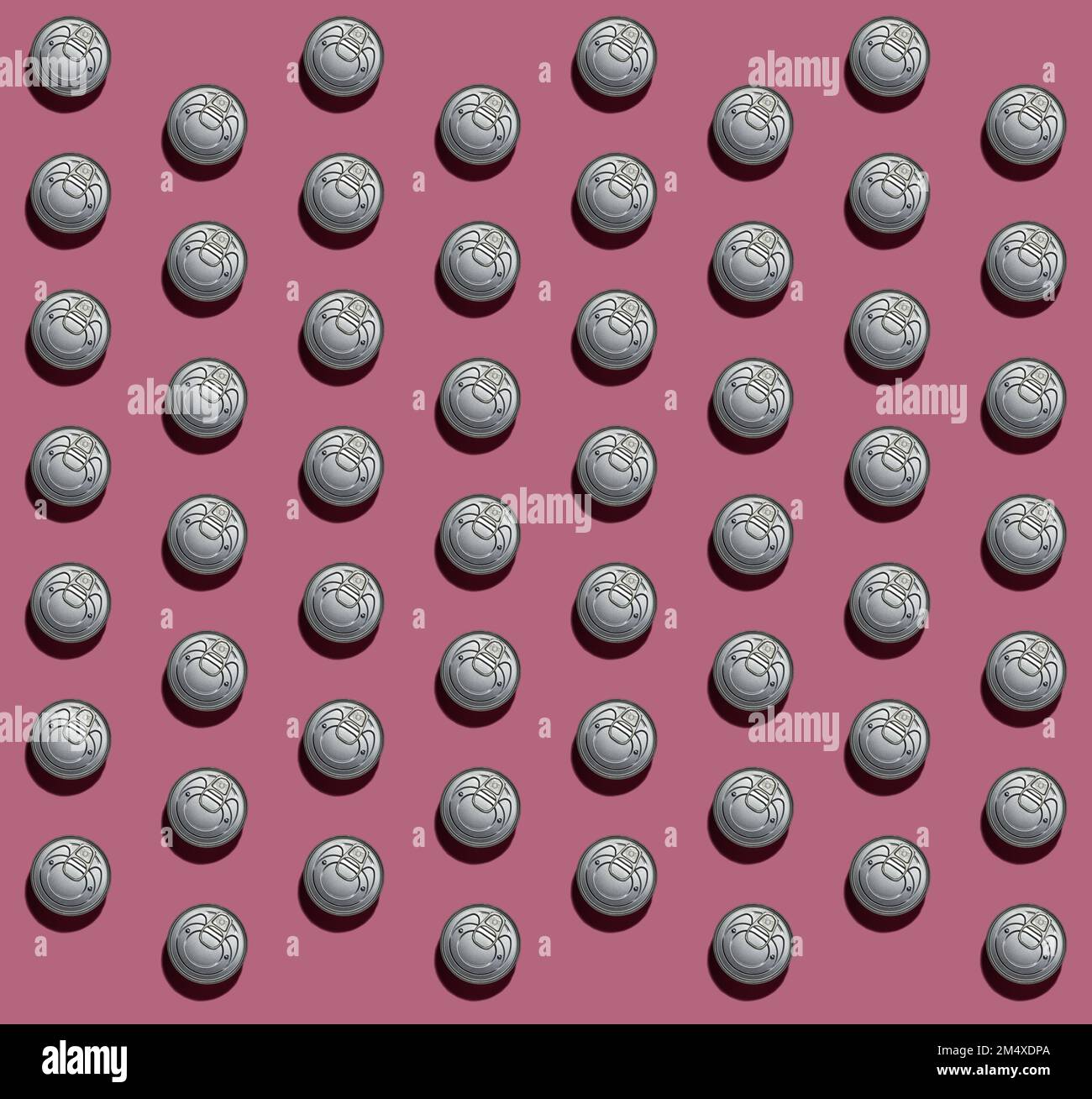 Pattern of rows of cans flat laid against purple background Stock Photo ...