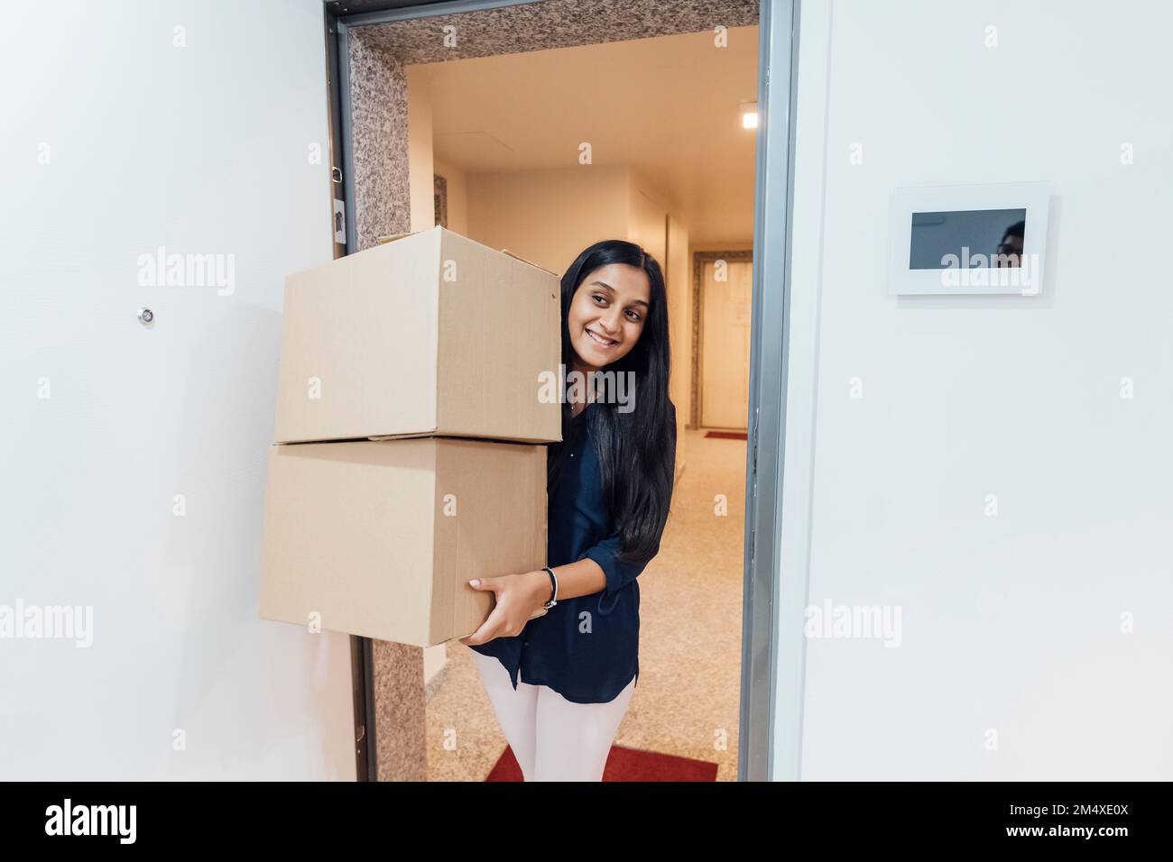 Man walking with boxes hi-res stock photography and images - Alamy