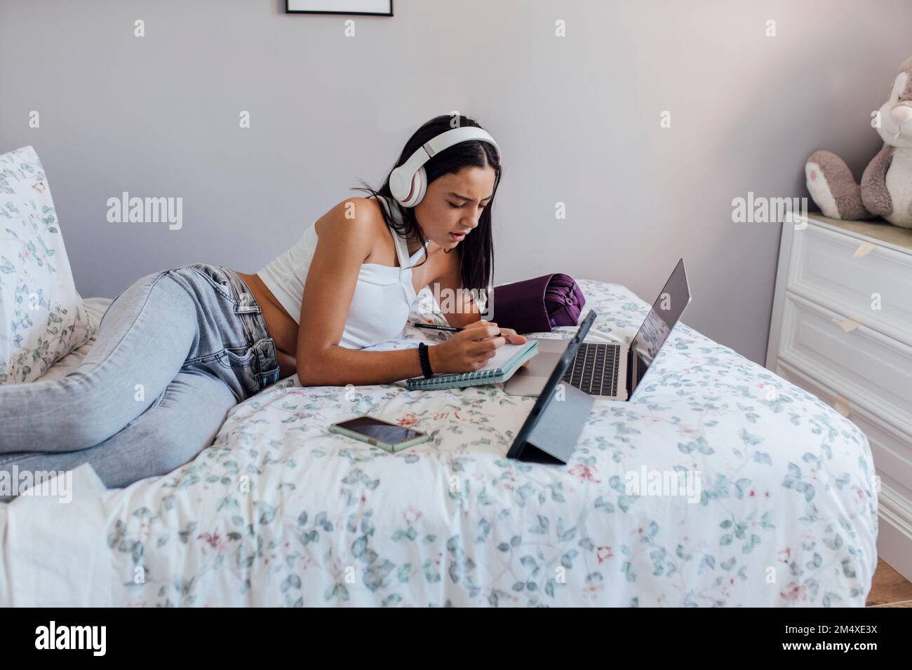 Girl with gadgets hi-res stock photography and images - Alamy