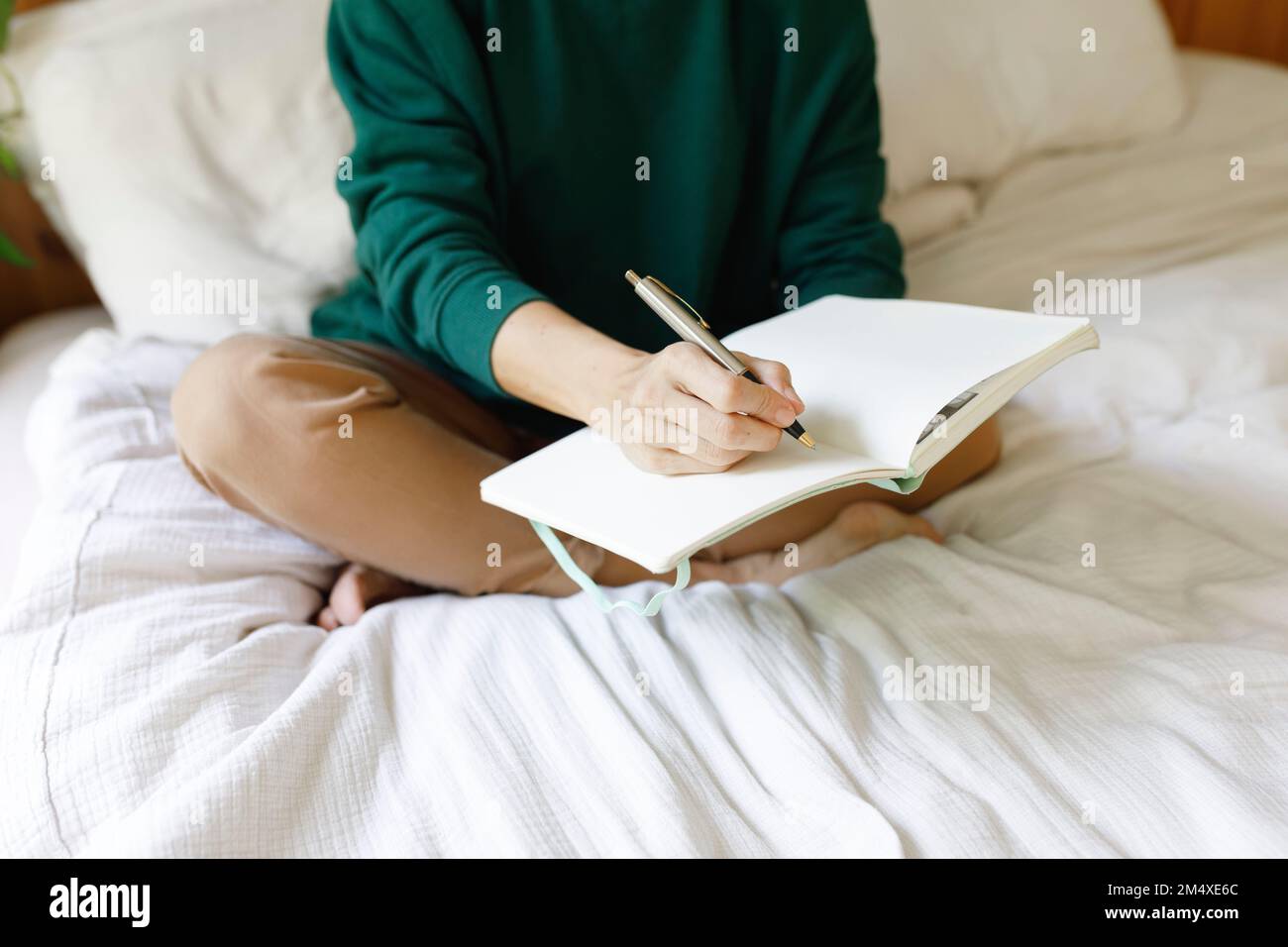 Woman writing diary bed hi-res stock photography and images - Alamy