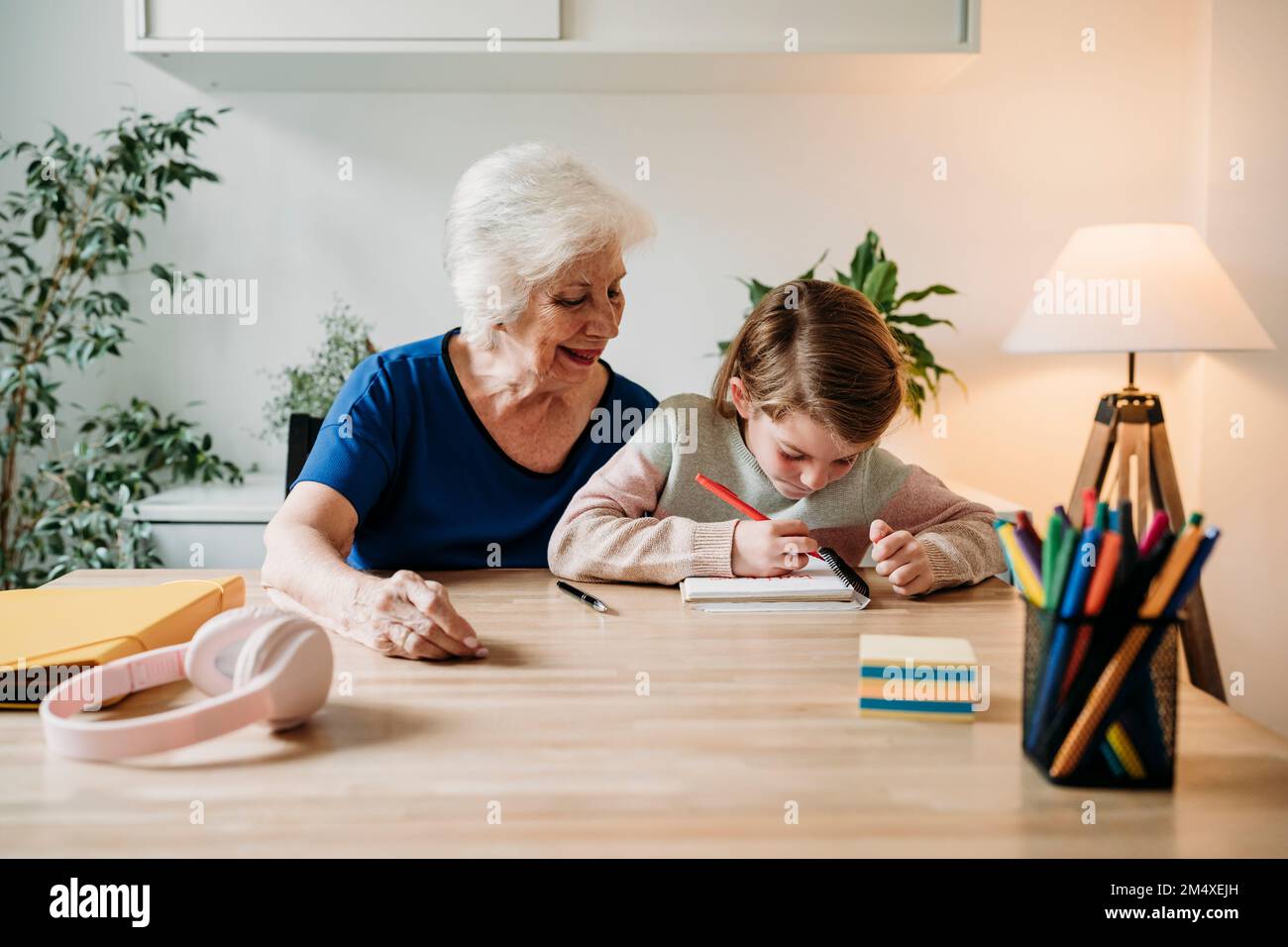 Girl helping grandmother hi-res stock photography and images - Alamy