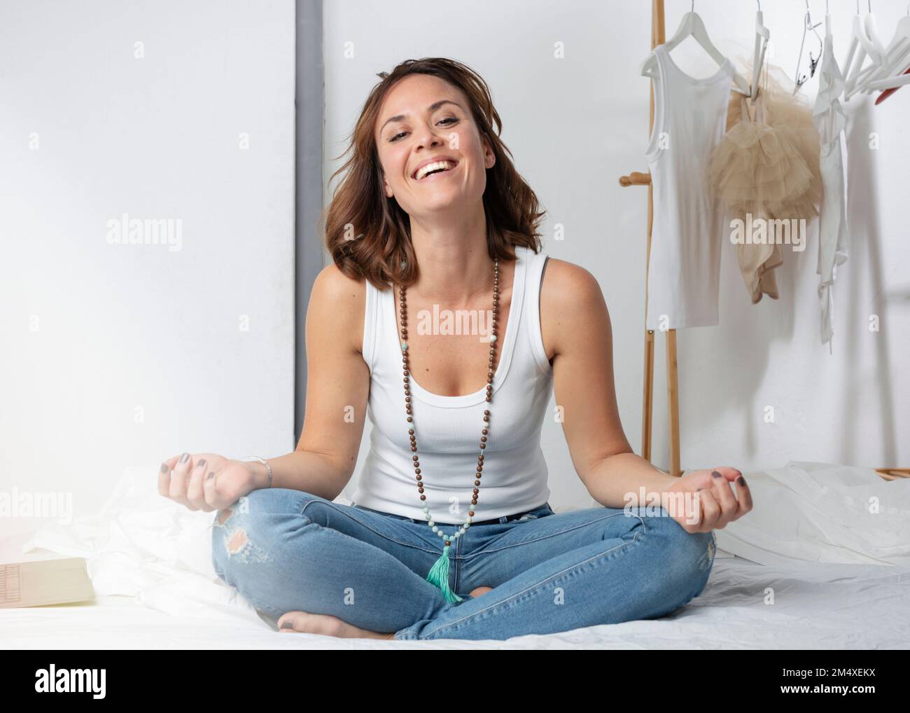 Happy woman practicing meditation at home Stock Photo - Alamy