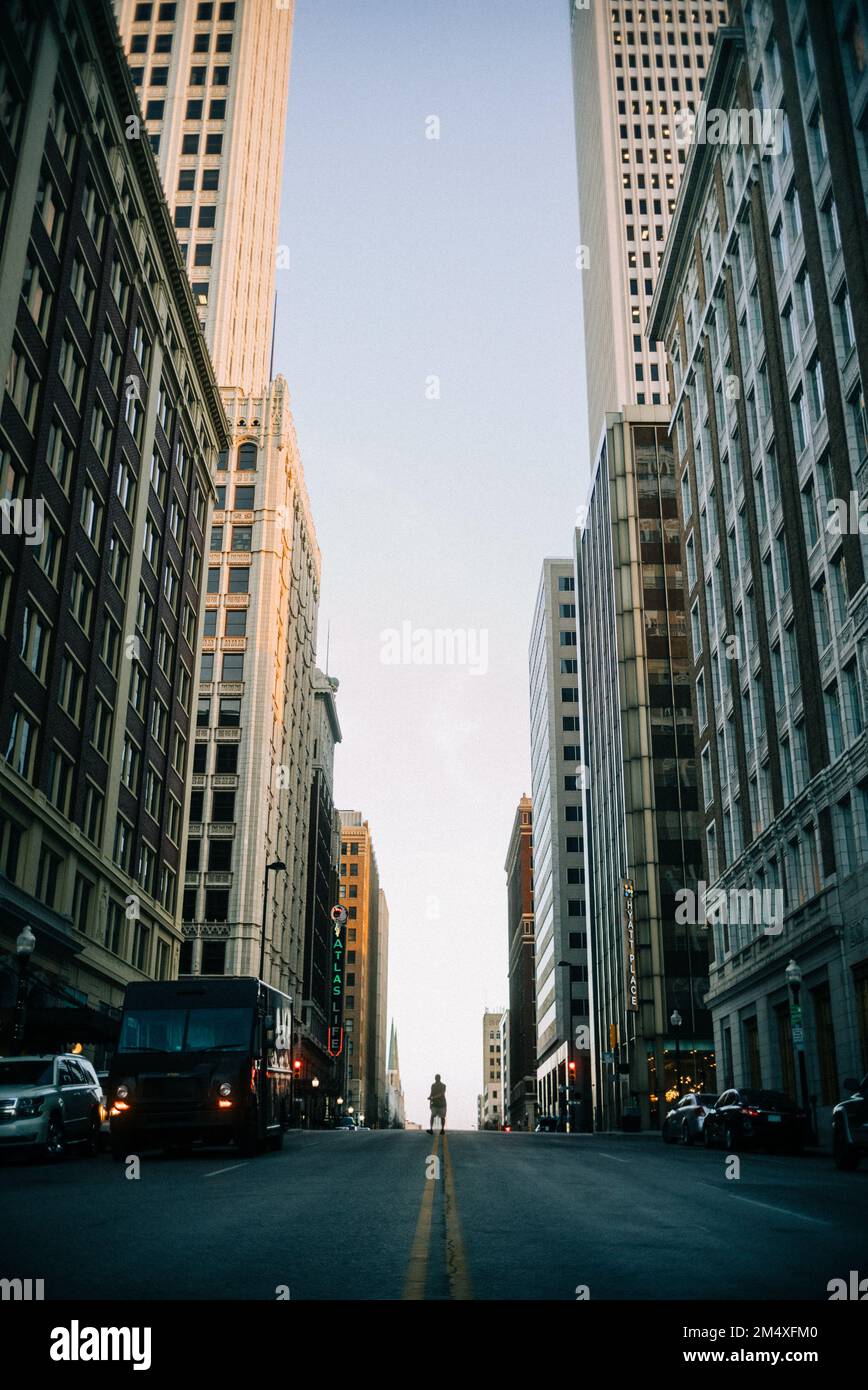 A vertical shot of a street between two buildings in downtown of Tulsa ...