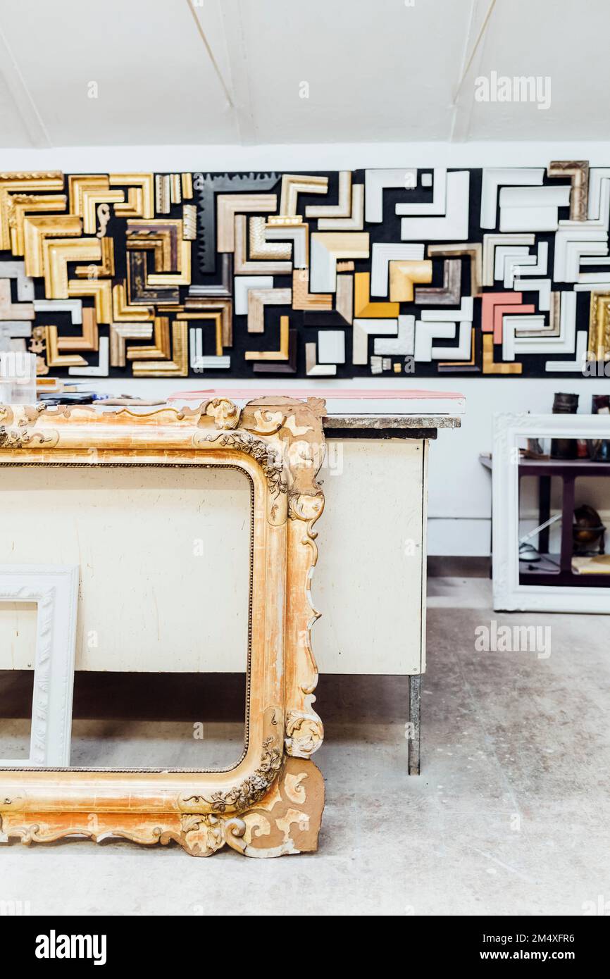 Wall with different kind of frame samples in workshop Stock Photo - Alamy