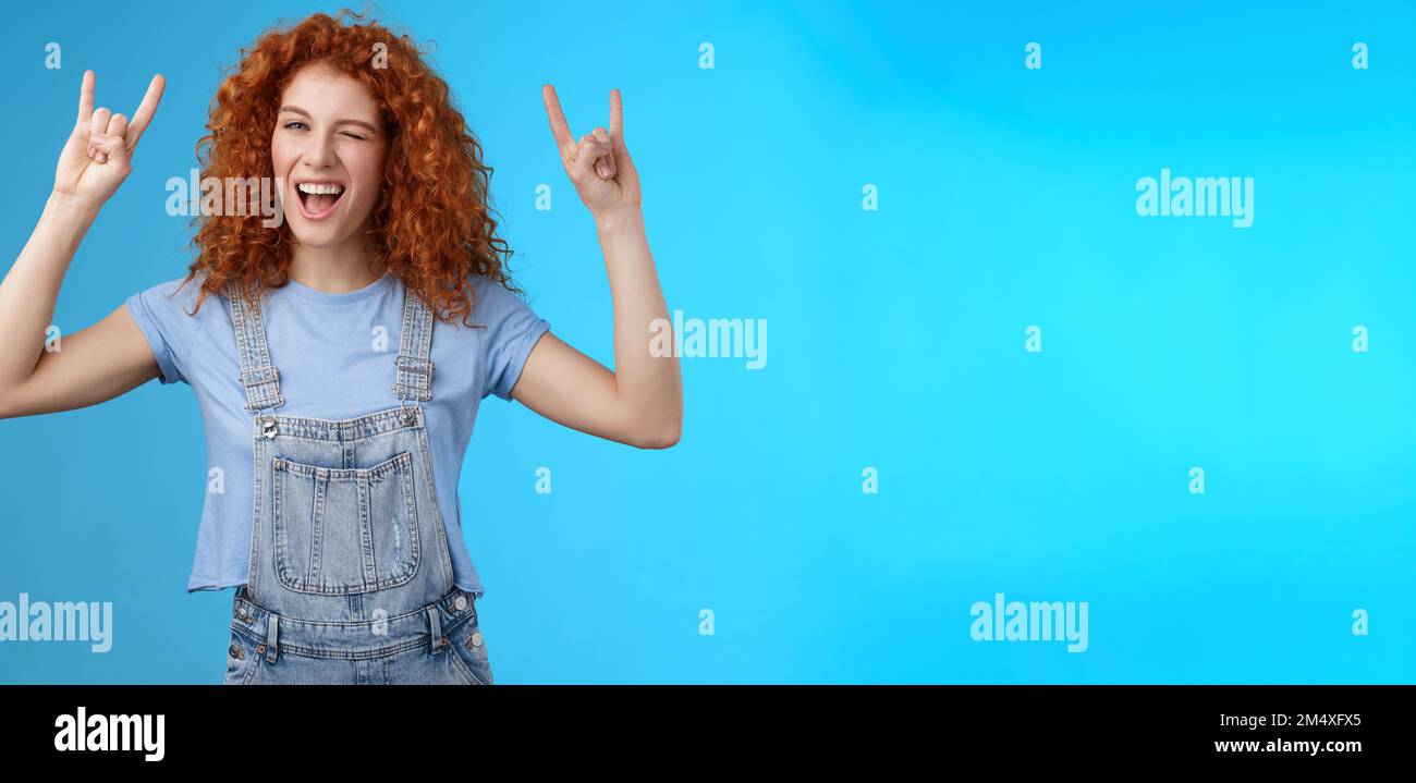 Daring cool sassy redhead ginger girl curly natural hairstyle winking ...