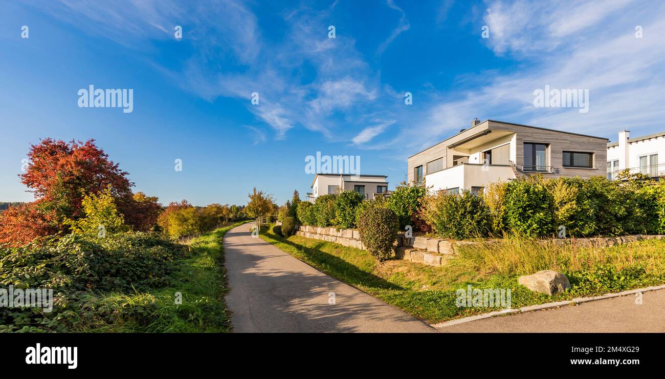 Asphalt footpath stretching modern suburban houses hi-res stock ...