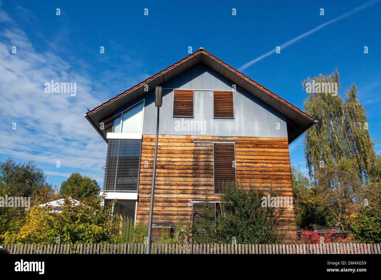 Germany, Bavaria, Munich, Exterior of modern passive house with wooden ...
