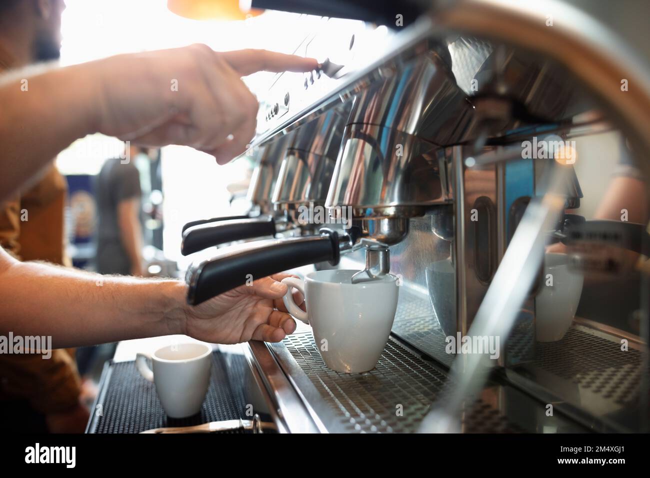 Hands of barista making coffee with espresso machine Stock Photo - Alamy