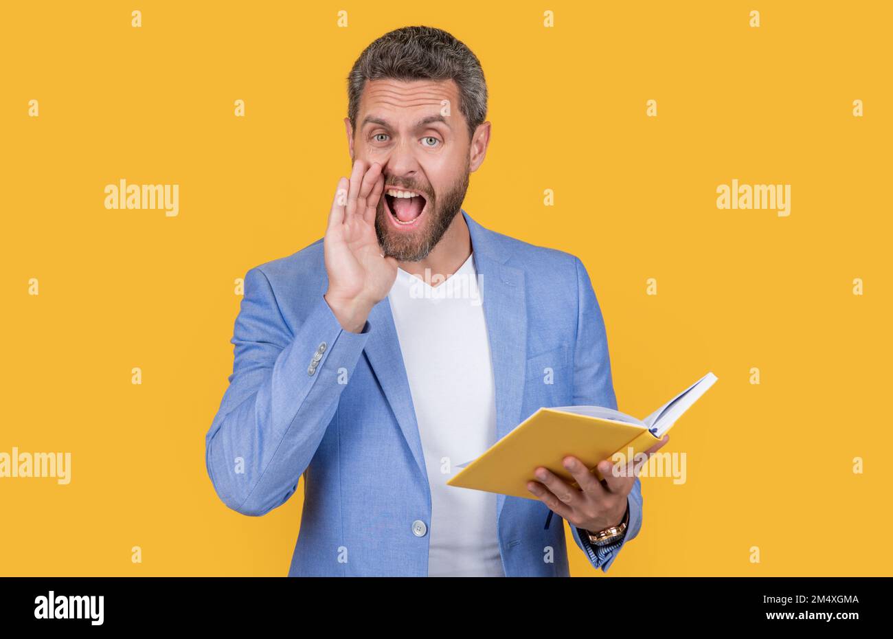 shouting teacher reading book isolated on yellow background. reading ...