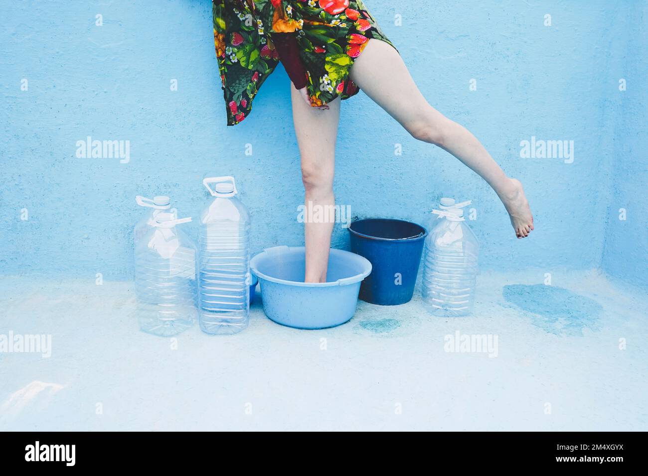 Woman standing in empty bucket inside swimming pool Stock Photo - Alamy