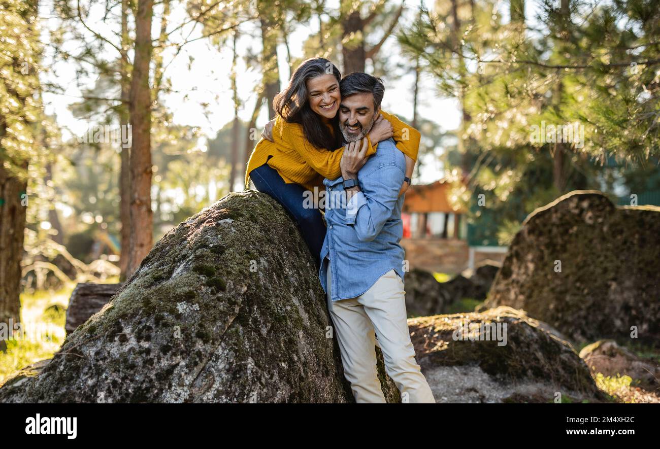 Happy mature couple hugging outdoors Stock Photo - Alamy