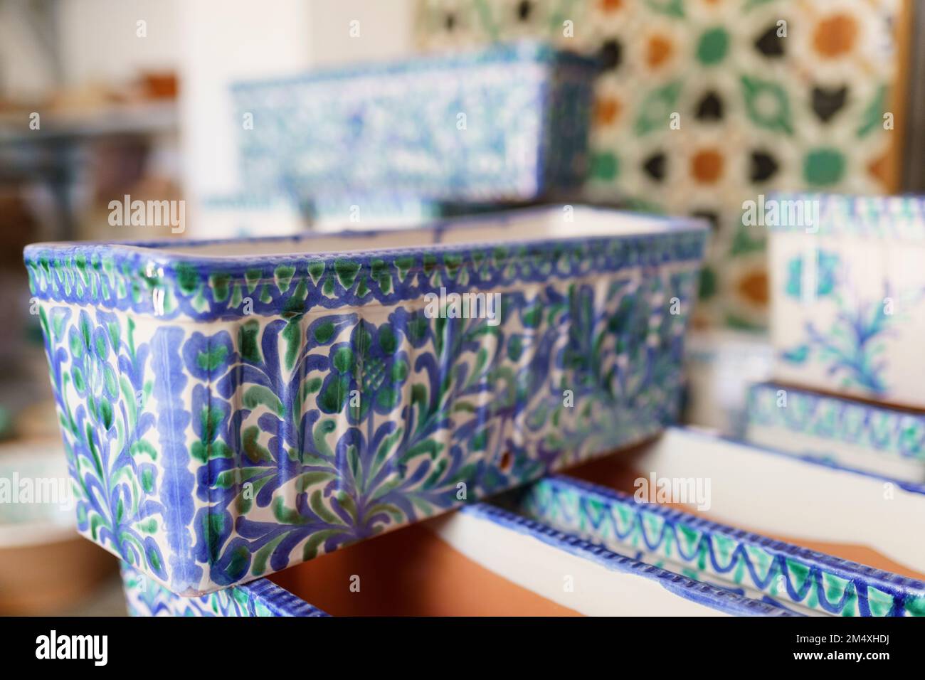 Patterned ceramic container on display in factory Stock Photo - Alamy