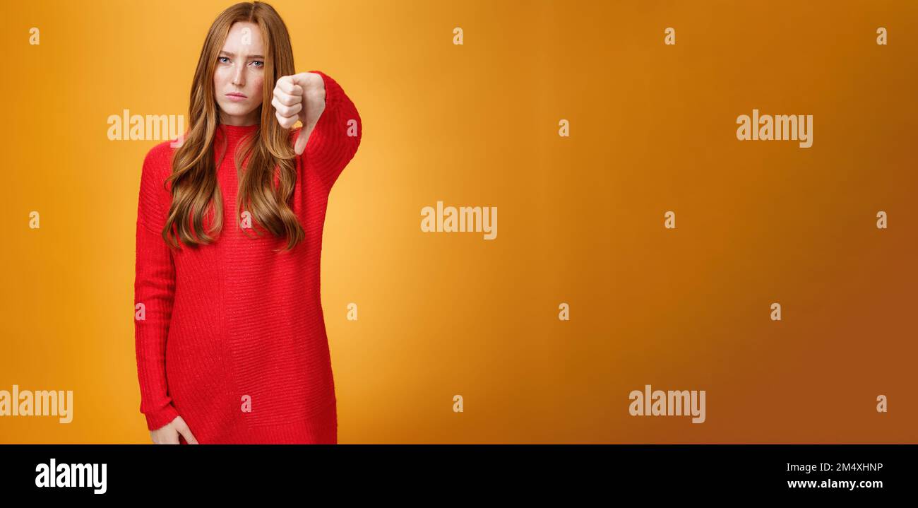 Disappointed upset and serious-looking attractive 20s redhead woman in ...