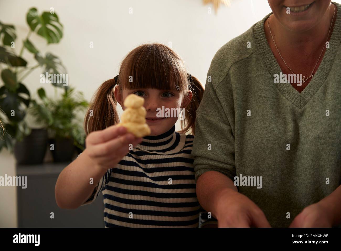 Smiling mother daughter preparing dough hi-res stock photography and ...