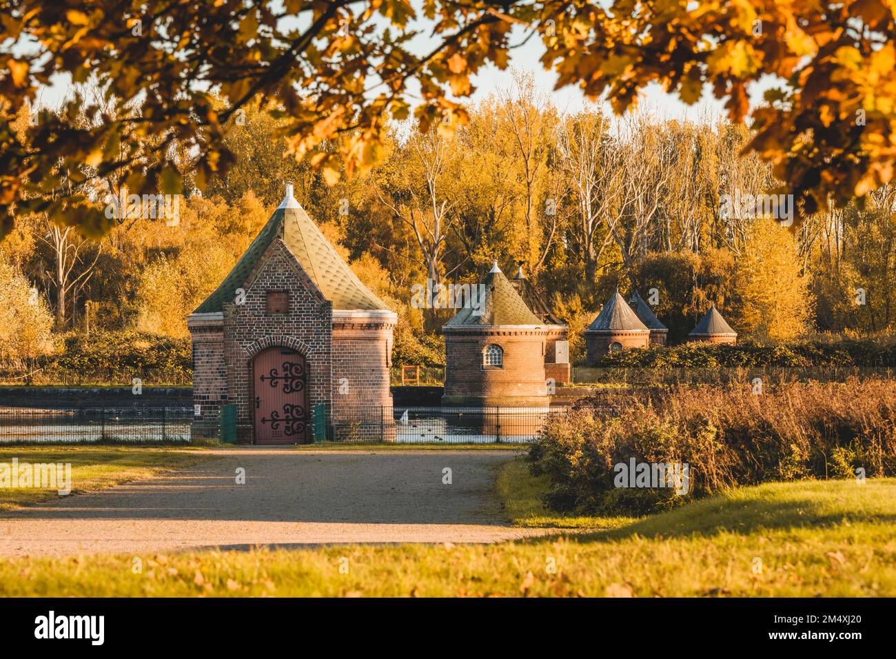 Germany, Hamburg, Historic filter houses on Kaltehofe island in autumn ...