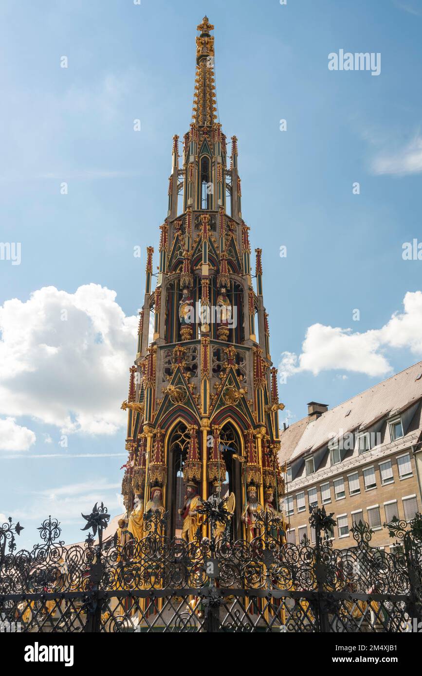 Germany, Bavaria, Nuremberg, Gothic spire of Schoner Brunnen fountain ...