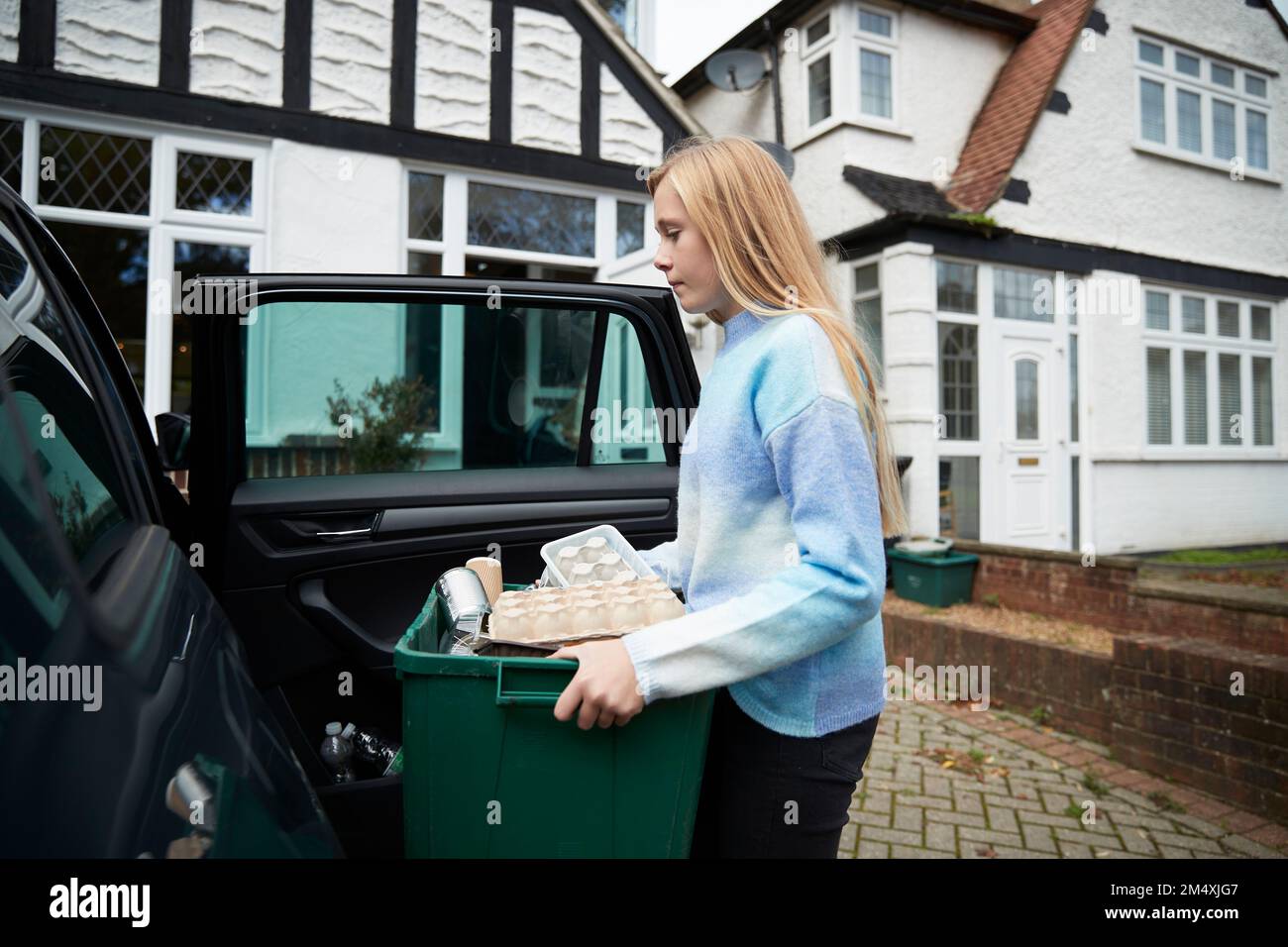 Girl dustbin hi-res stock photography and images - Alamy