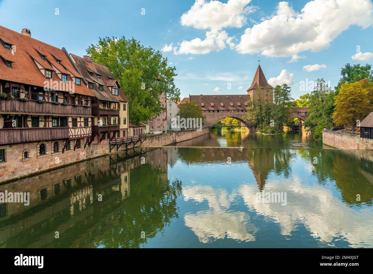 Germany, Bavaria, Nuremberg, Pegnitz river with Schlayerturm in ...