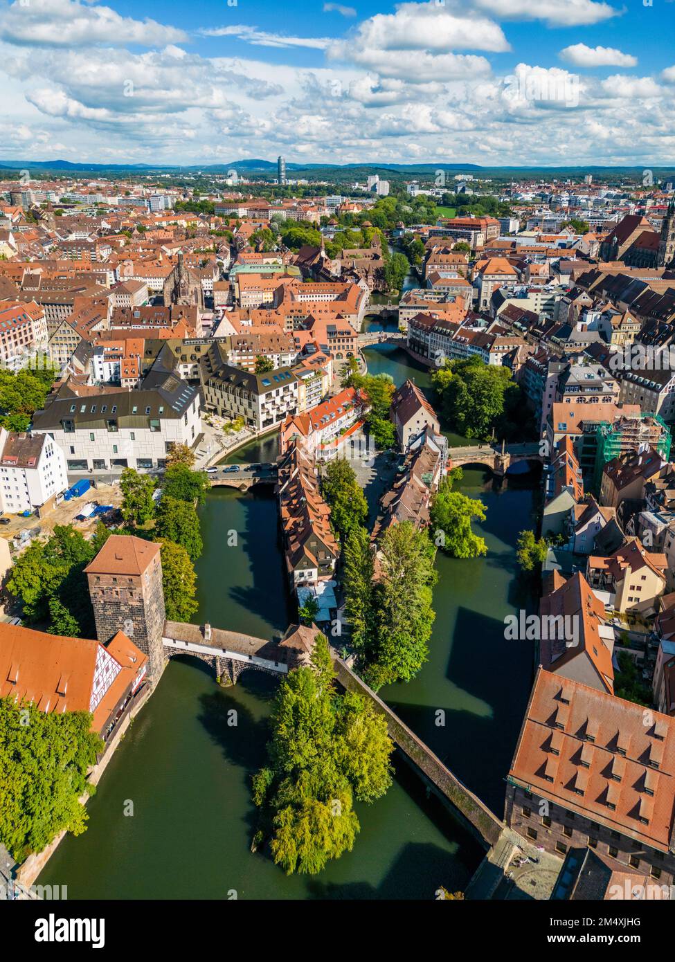 Germany, Bavaria, Nuremberg, Pegnitz river flowing through historic old ...