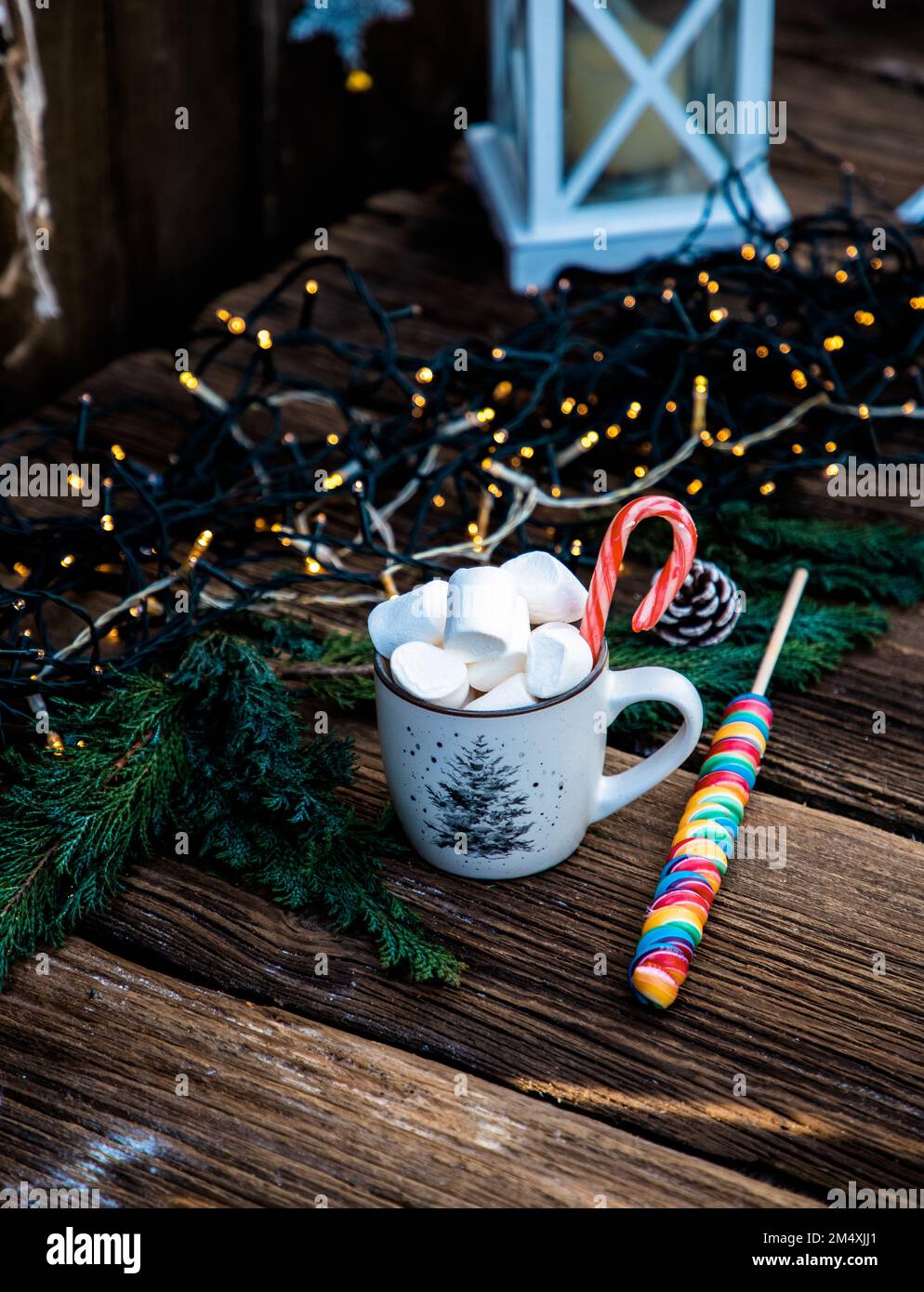 hot Christmas drink with marshmallow on wooden table Stock Photo - Alamy