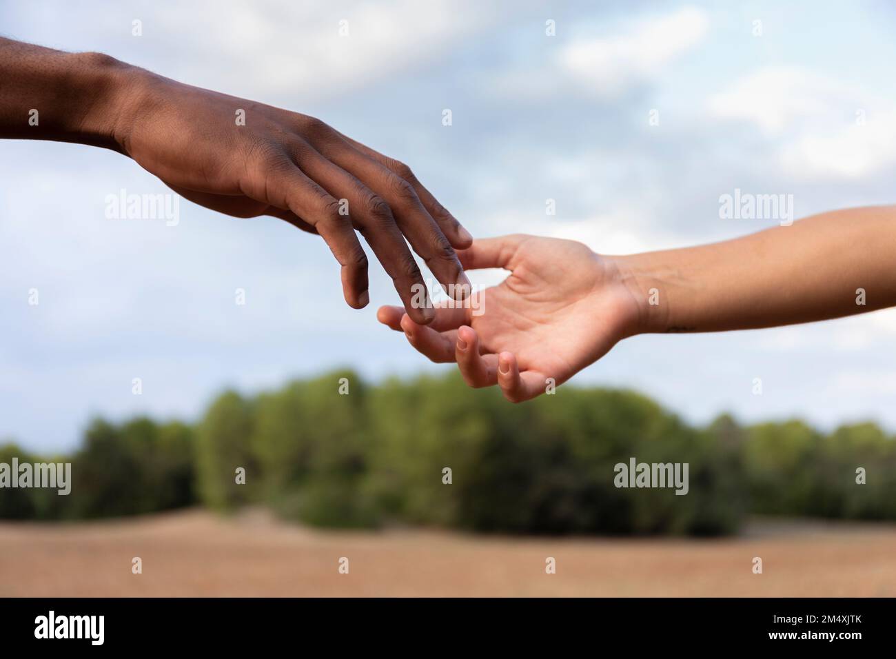 Woman touching hand hi-res stock photography and images - Alamy