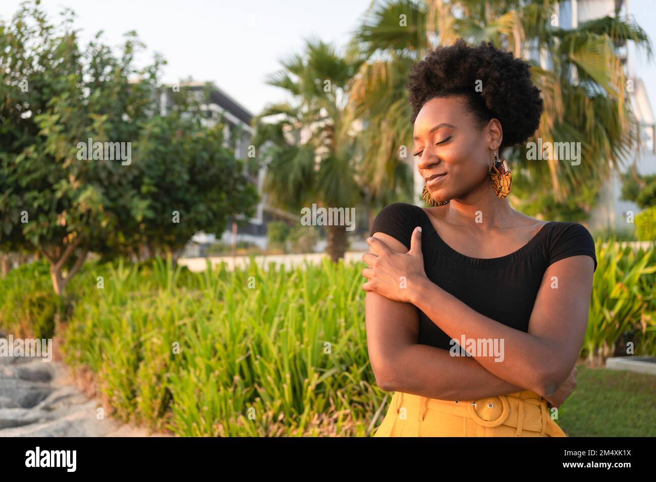 Woman hugging herself eyes hi-res stock photography and images - Alamy