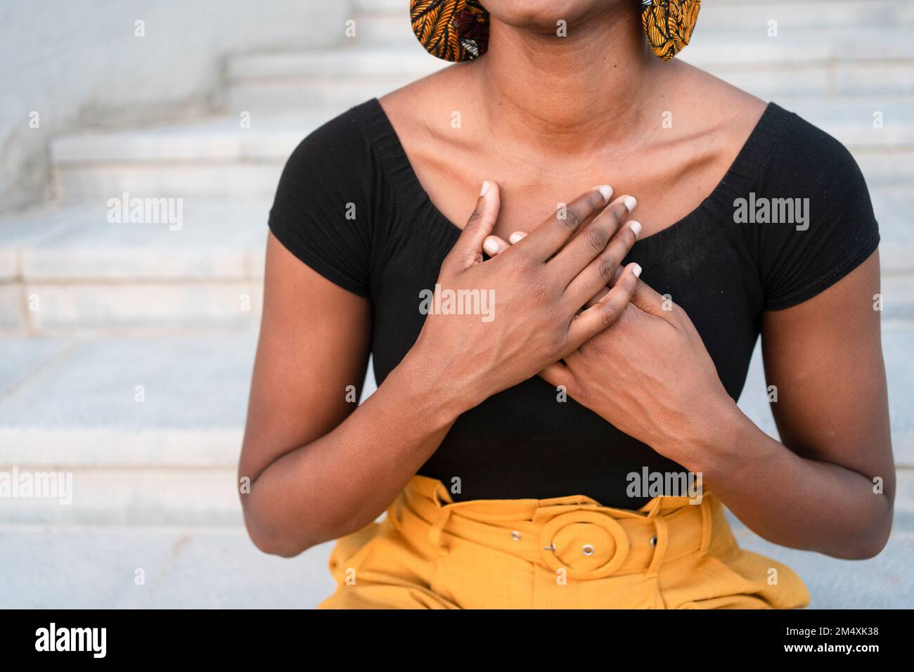 Woman sitting on chest hi-res stock photography and images - Alamy
