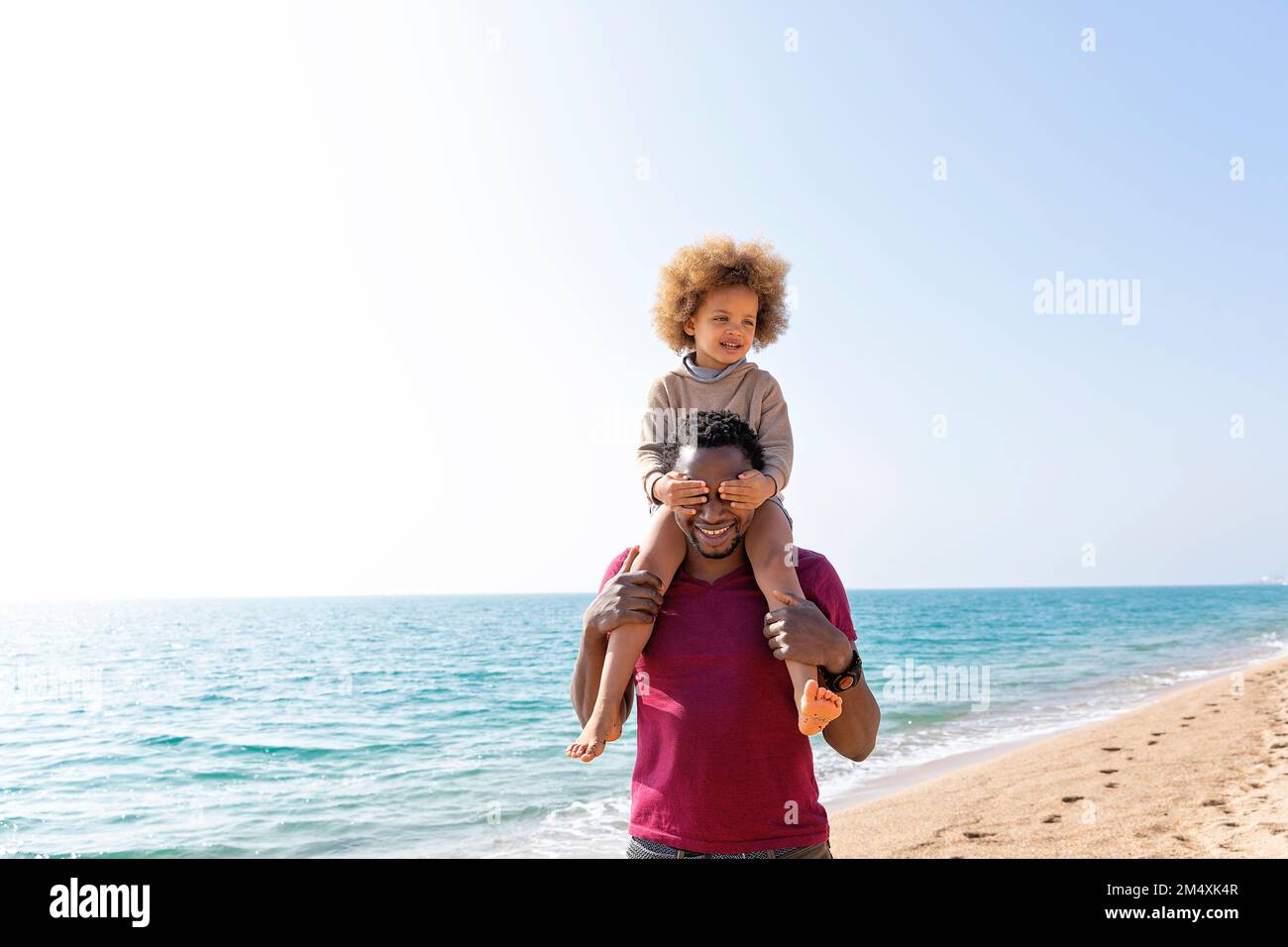 Happy girl sitting on the shoulders of adult male hi-res stock photography and images - Alamy