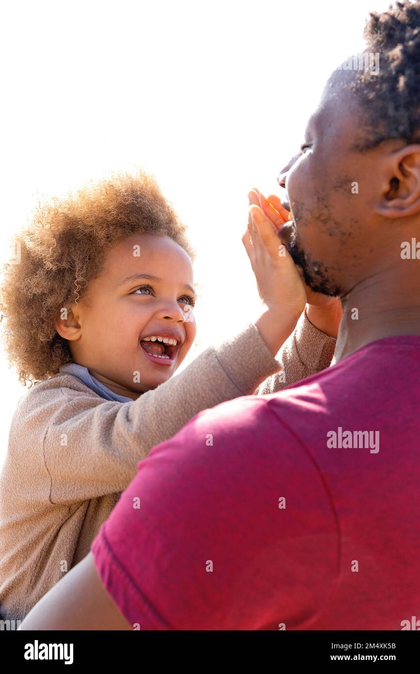Happy cute daughter playing and having fun with father Stock Photo - Alamy