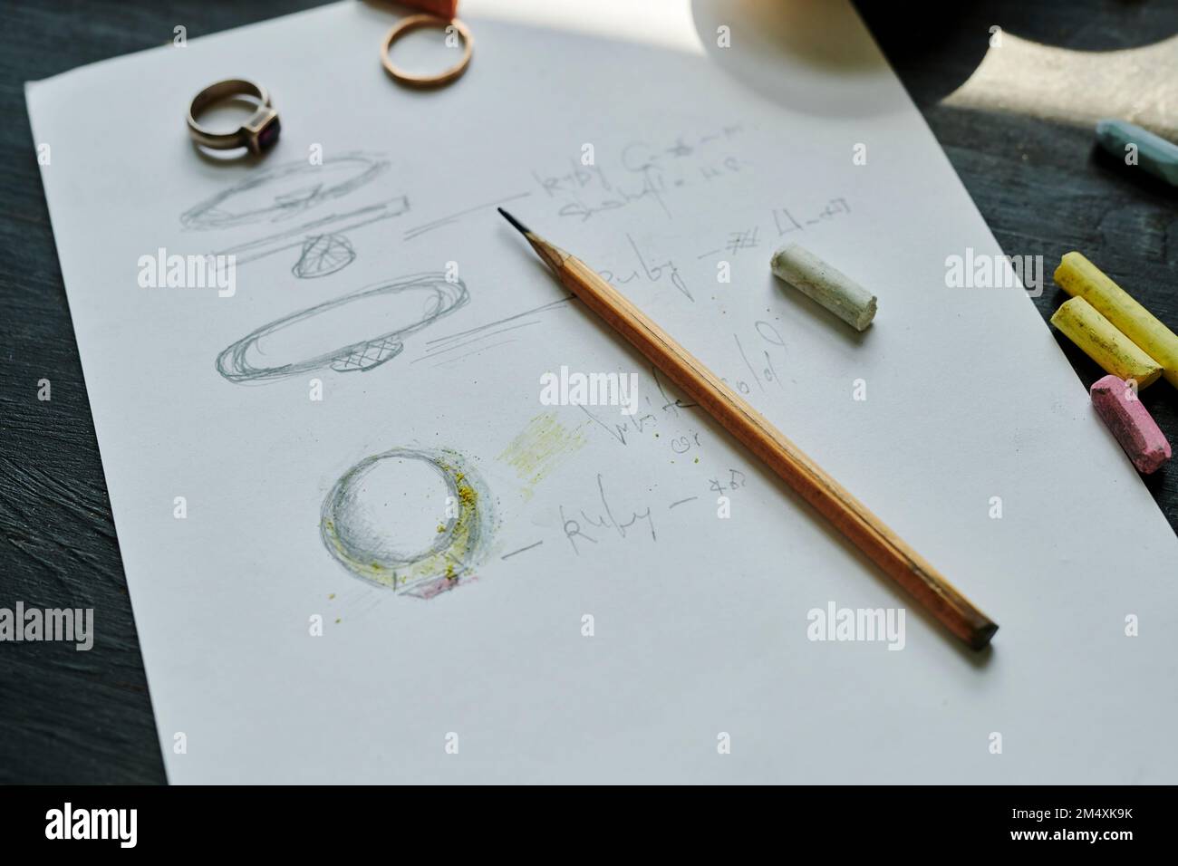 Pencil on paper with drawing of rings at workbench Stock Photo - Alamy
