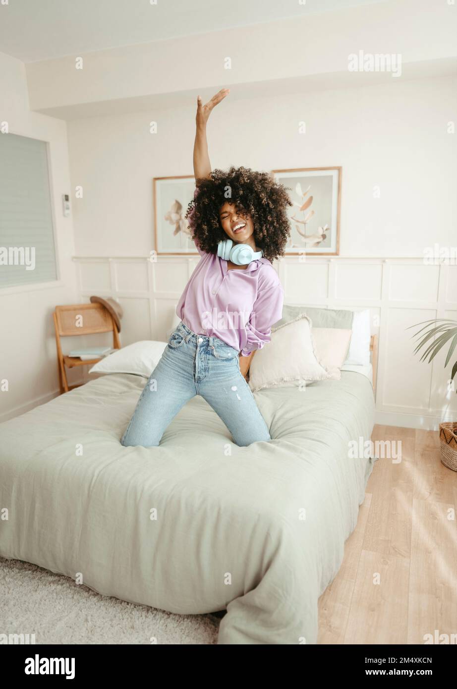 Woman Kneeling On Bed