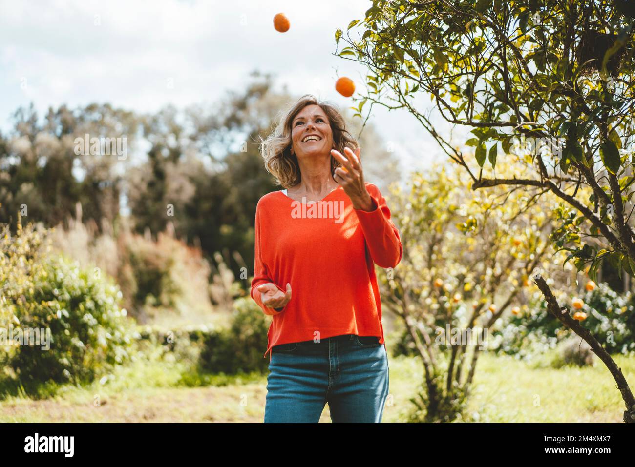 Mature woman happy garden hi-res stock photography and images - Alamy