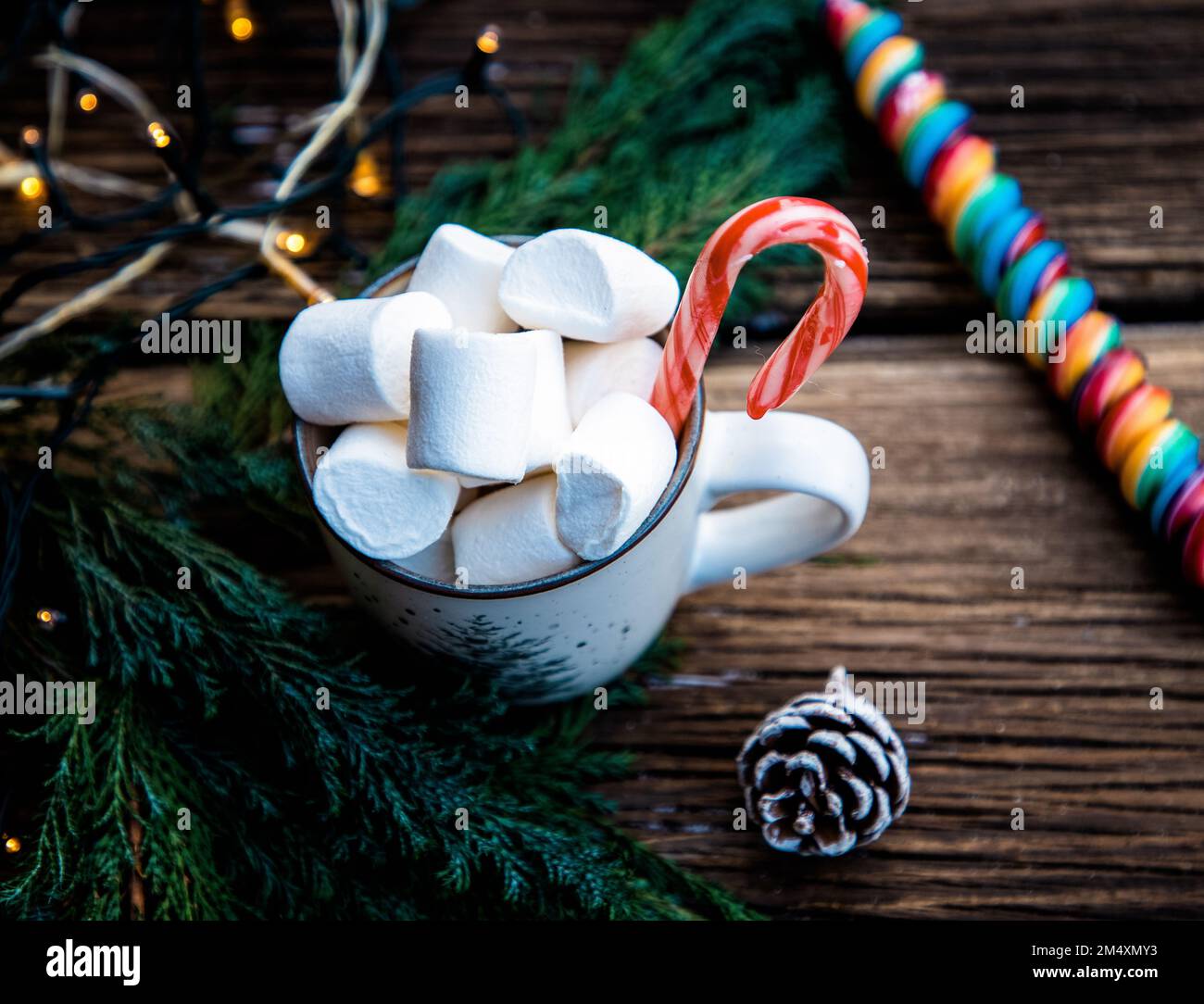 hot Christmas drink with marshmallow on wooden table Stock Photo - Alamy