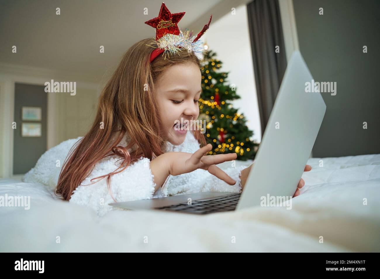 Cute girl typing on laptop hi-res stock photography and images - Alamy