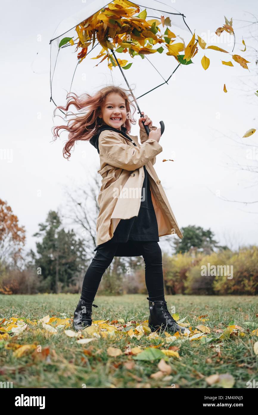 Girl wind umbrella hi-res stock photography and images - Alamy