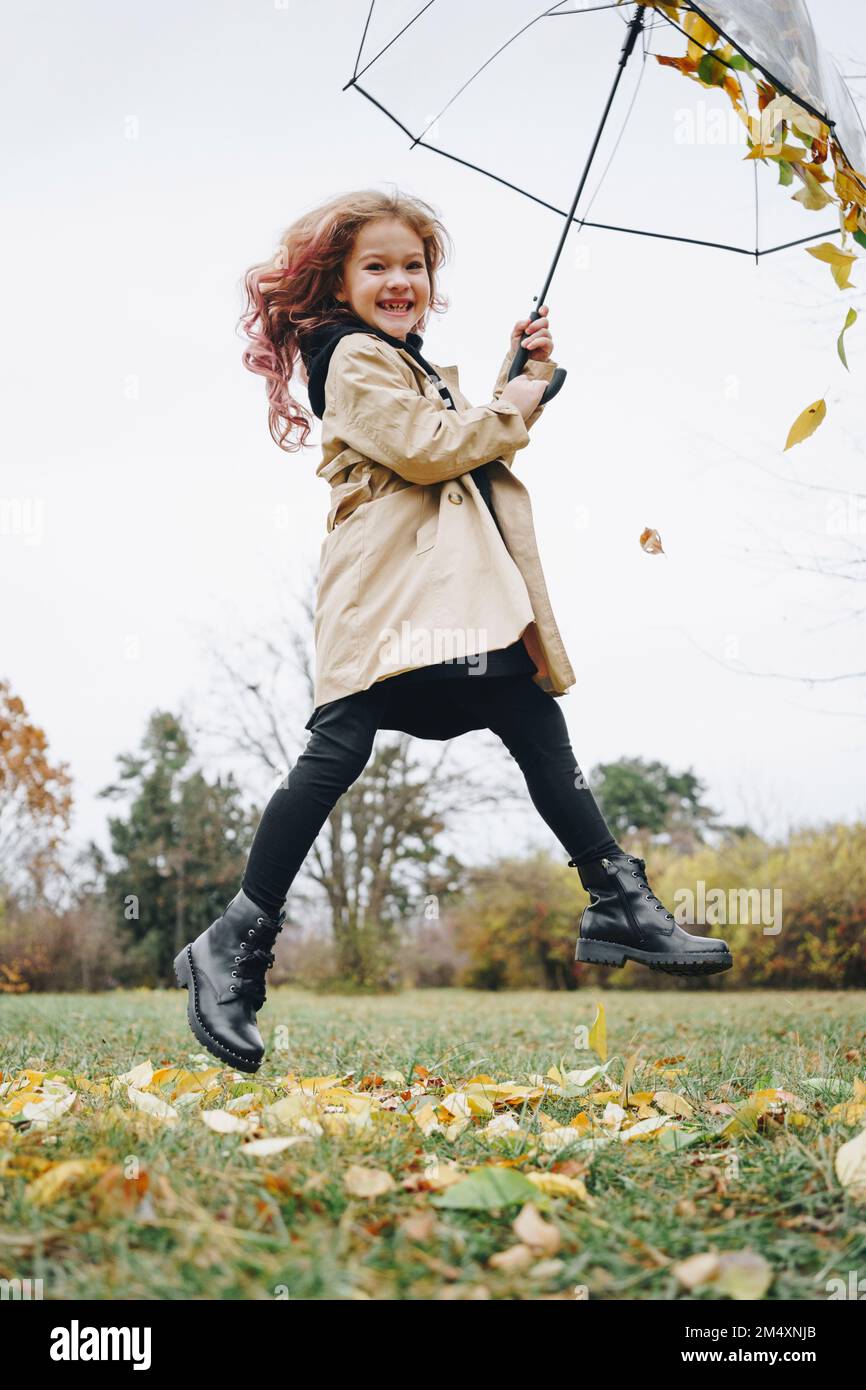 Happy children jumping park hi-res stock photography and images - Alamy