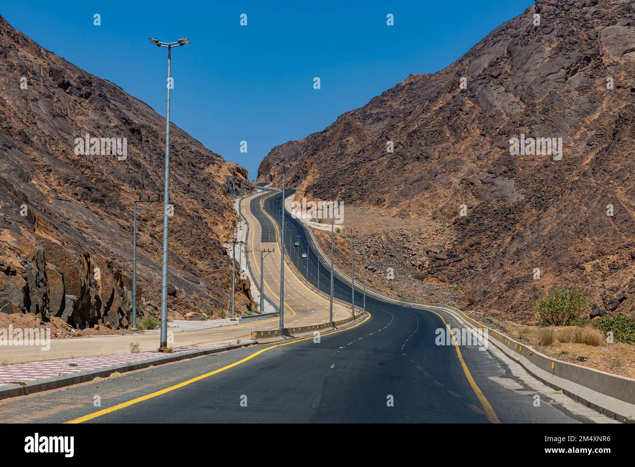 Saudi Arabia, Najran Province, Najran, Asphalt road in rocky mountains ...