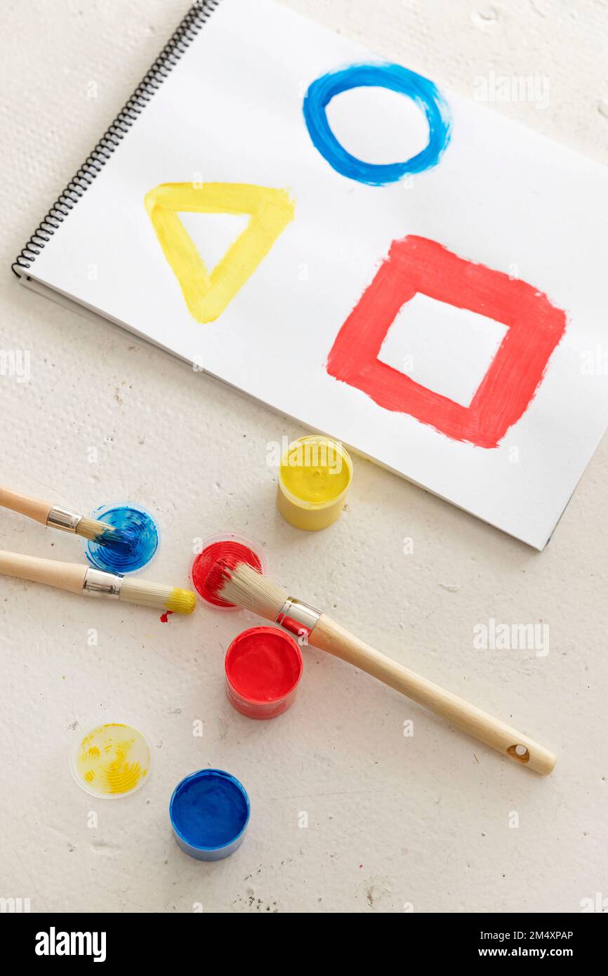 Colorful geometric shapes painted in note pad Stock Photo - Alamy