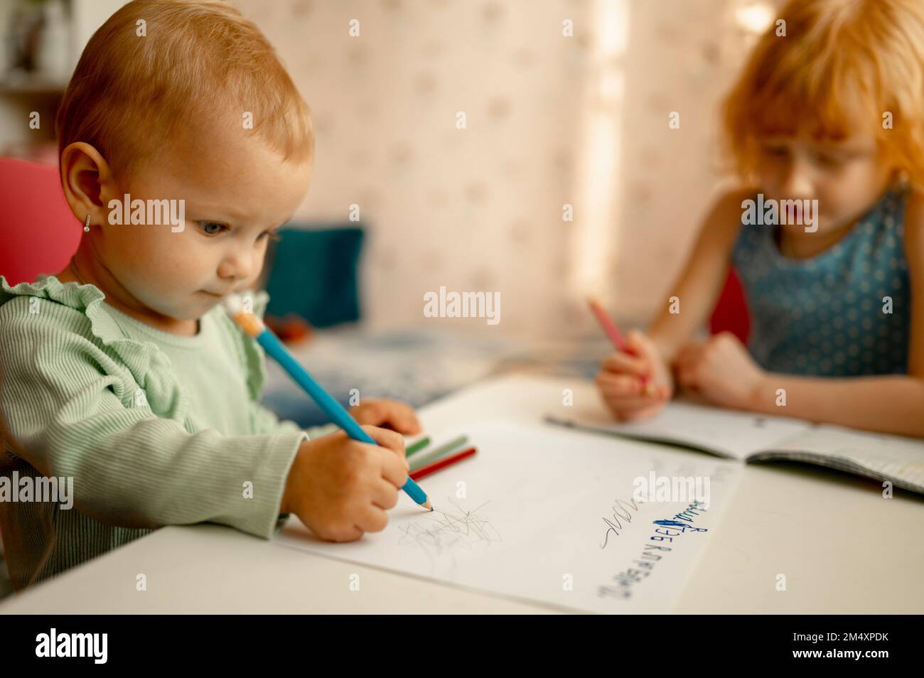 Caucasian girl with baby sister hi-res stock photography and images - Alamy