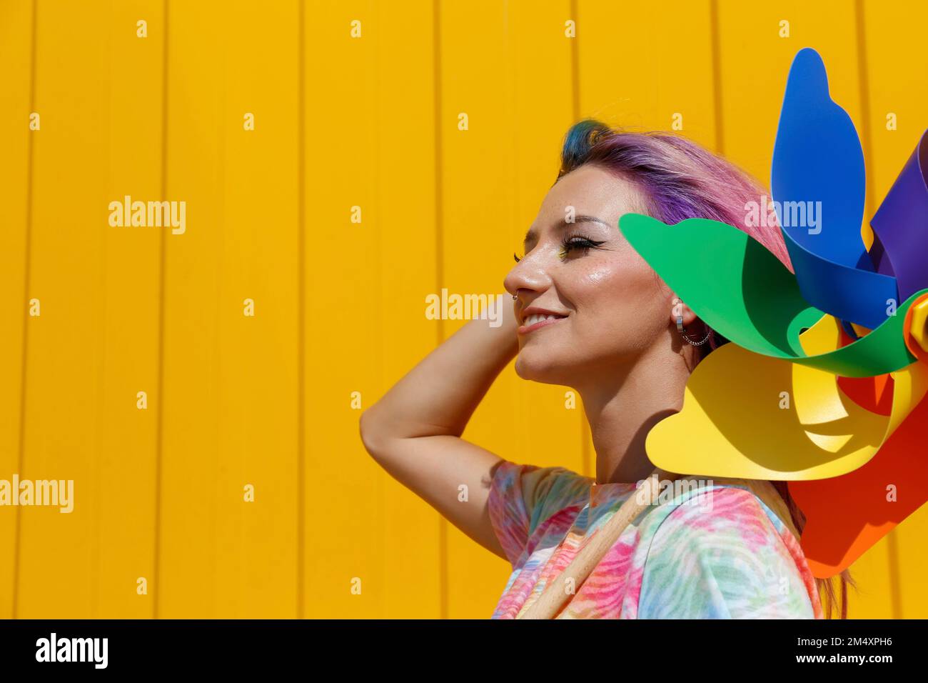 Woman holding colorful pinwheel eyes hi-res stock photography and ...