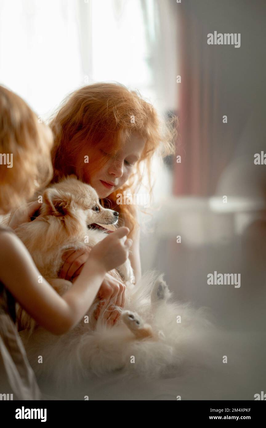 Cute siblings holding pets hi-res stock photography and images - Alamy