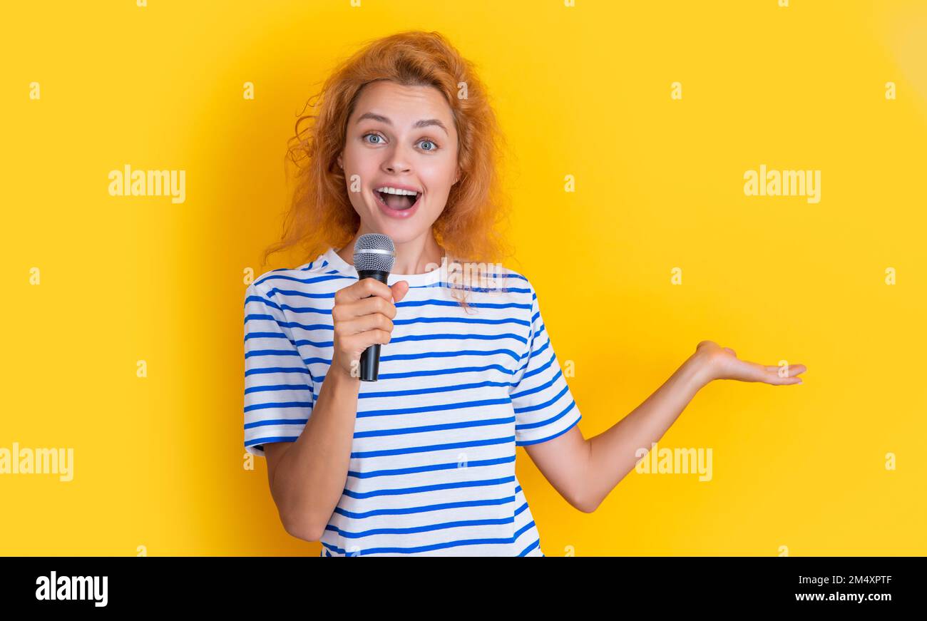 girl singer isolated on yellow background with copy space. young singer ...