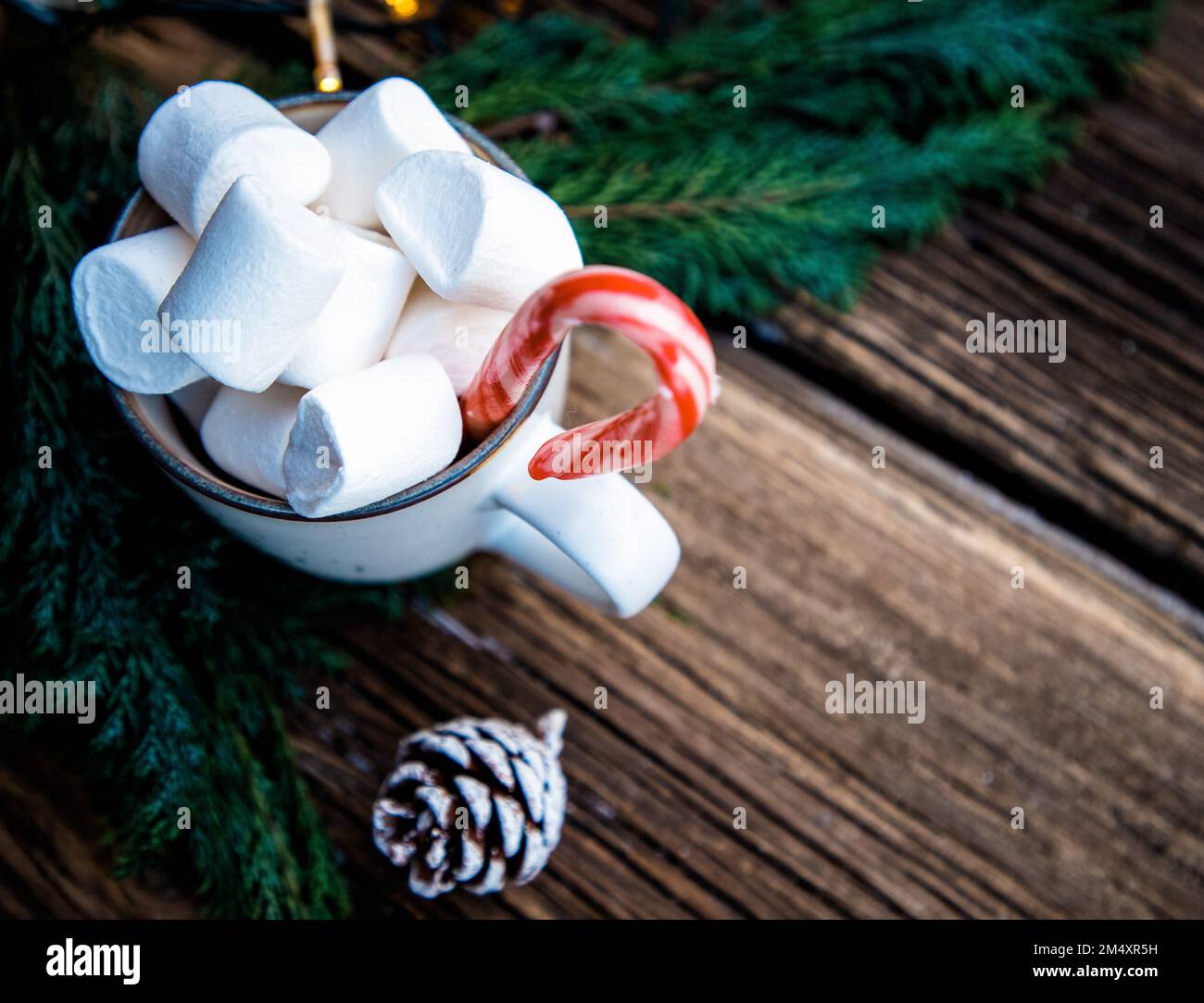 hot Christmas drink with marshmallow on wooden table Stock Photo - Alamy