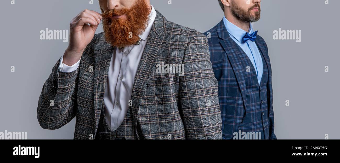 cropped view studio shot of gentlemen wearing tux. elegant gentlemen in ...