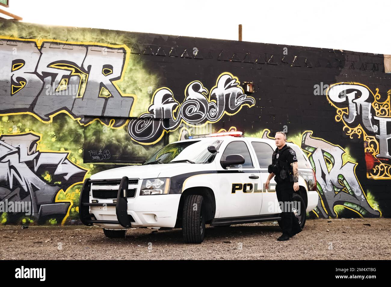 Horizontal image of white male caucasian police officer getting out of ...