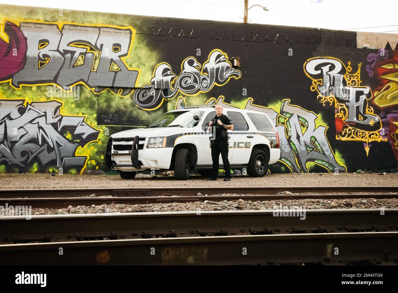 Horizontal image of white male caucasian police officer posing in front ...